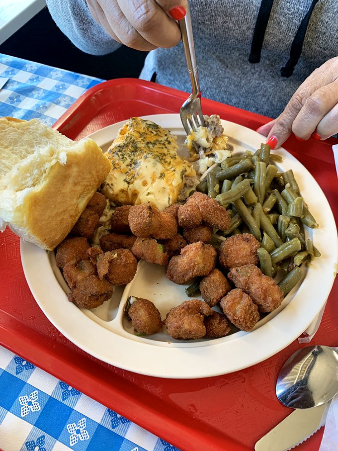 Breakfast or lunch? When faced with cornbread, green beans, and mac and cheese alongside your protein, time becomes irrelevant.
