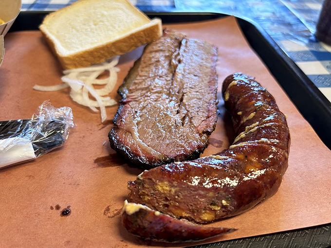 Brisket and sausage: the Batman and Robin of BBQ. One's dark and complex, the other's a spicy sidekick, and together they fight hunger crimes across Russellville.