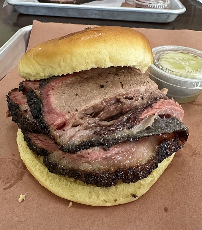 This brisket sandwich isn't just lunch&mdash;it's an edible monument to patience, smoke, and the pursuit of barbecue perfection.