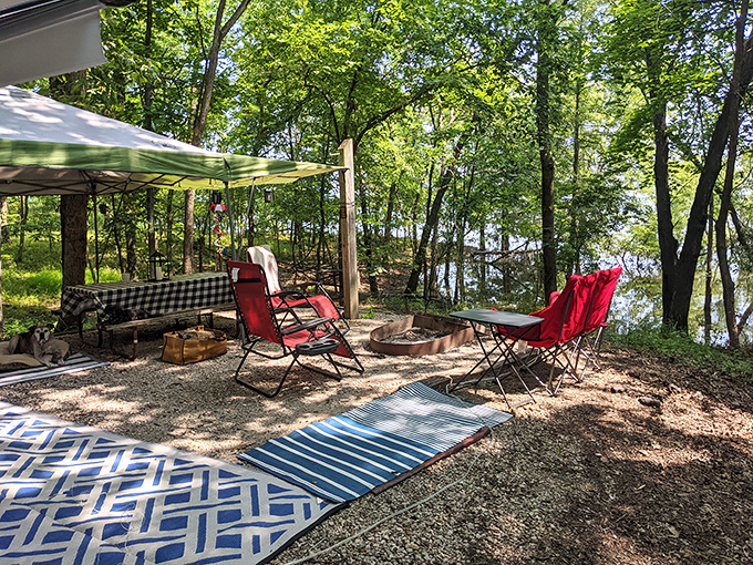 Camping nirvana: where shade trees, lake views, and comfortable chairs converge. This spot wasn't discovered&mdash;it was earned by those who appreciate outdoor perfection.