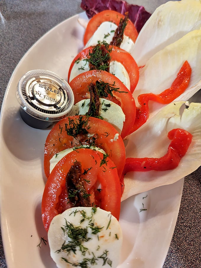 Caprese salad done right&mdash;where tomatoes and mozzarella perform their perfect duet with fresh dill playing conductor.