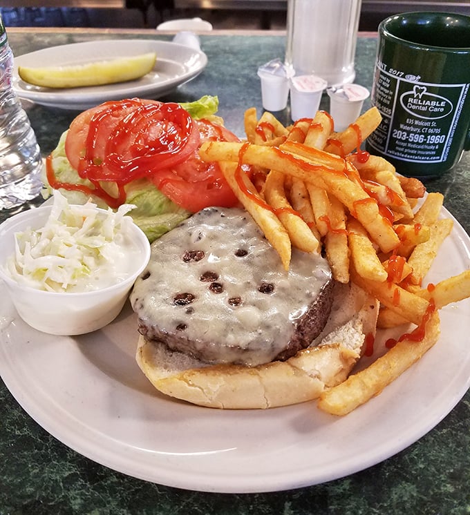 This isn't just a cheeseburger &ndash; it's a masterclass in diner perfection, complete with crispy fries standing at attention.