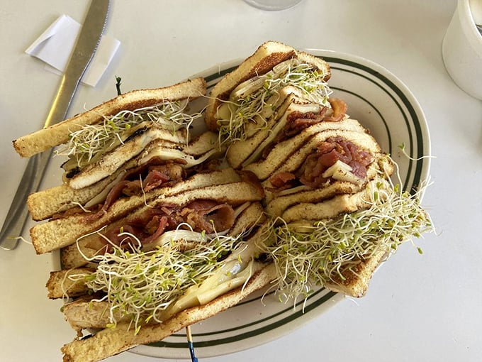 Architecture you can eat! This club sandwich stands taller than some Louisiana levees and is just as essential to local infrastructure.