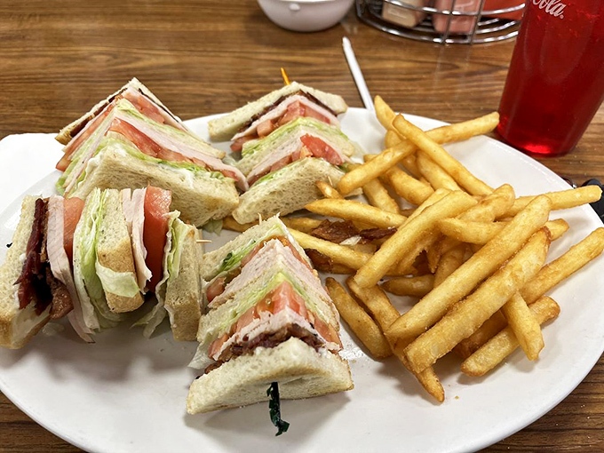 A club sandwich stacked taller than some Vegas hotels, with layers that tell a better story than most vacation slideshows. 