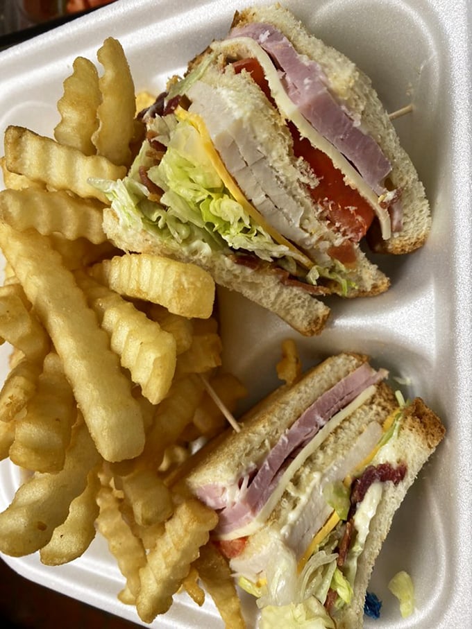 This club sandwich has more layers than an onion&mdash;or your favorite soap opera. The toothpick is doing structural engineering work worthy of a Nobel Prize.