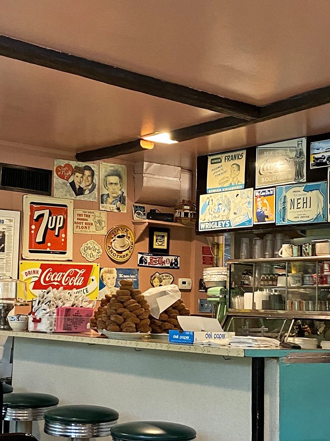 The counter view reveals the diner's beating heart &ndash; vintage signs, classic supplies, and the promise of coffee that keeps flowing like conversation.