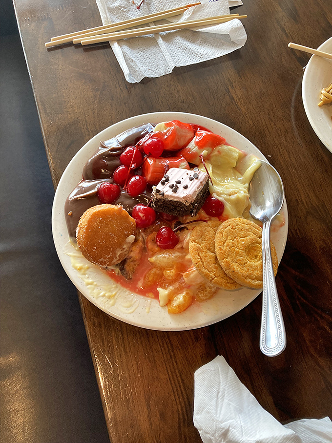 Dessert: where restraint goes to die. This plate proves that even after "I'm full," there's always room for pudding, cake, and those little cookies.