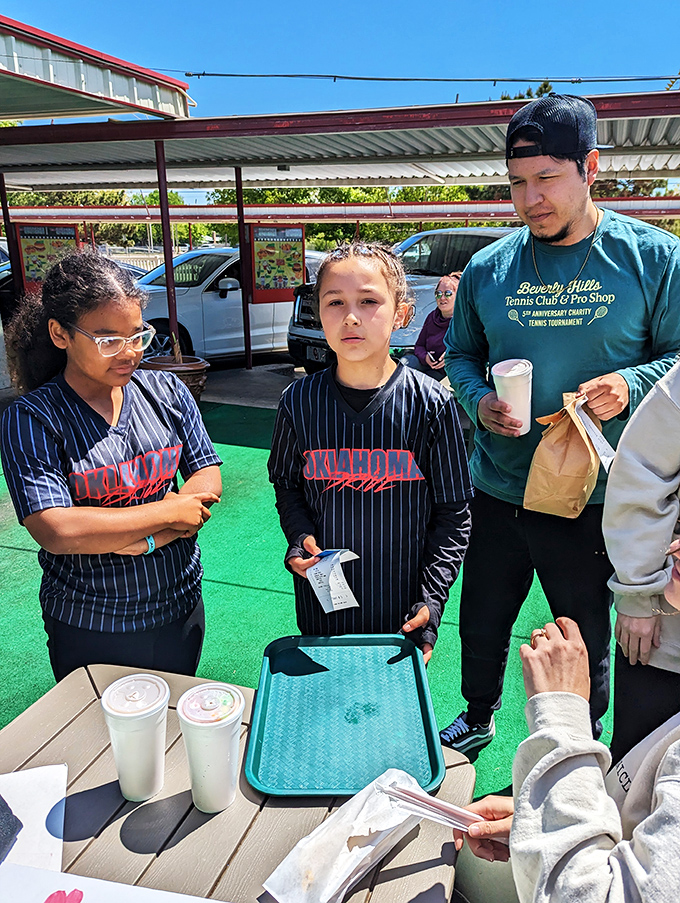 Nothing says "Oklahoma weekend" quite like families in baseball gear bonding over burgers and shakes after the big game.