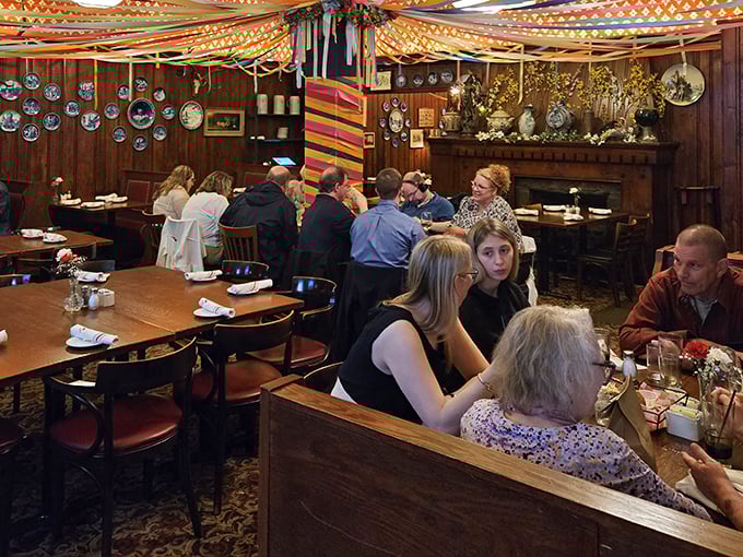 Happy diners gathered in booths beneath colorful streamers&mdash;proof that gem&uuml;tlichkeit (that cozy German feeling) is alive and well in Massachusetts.