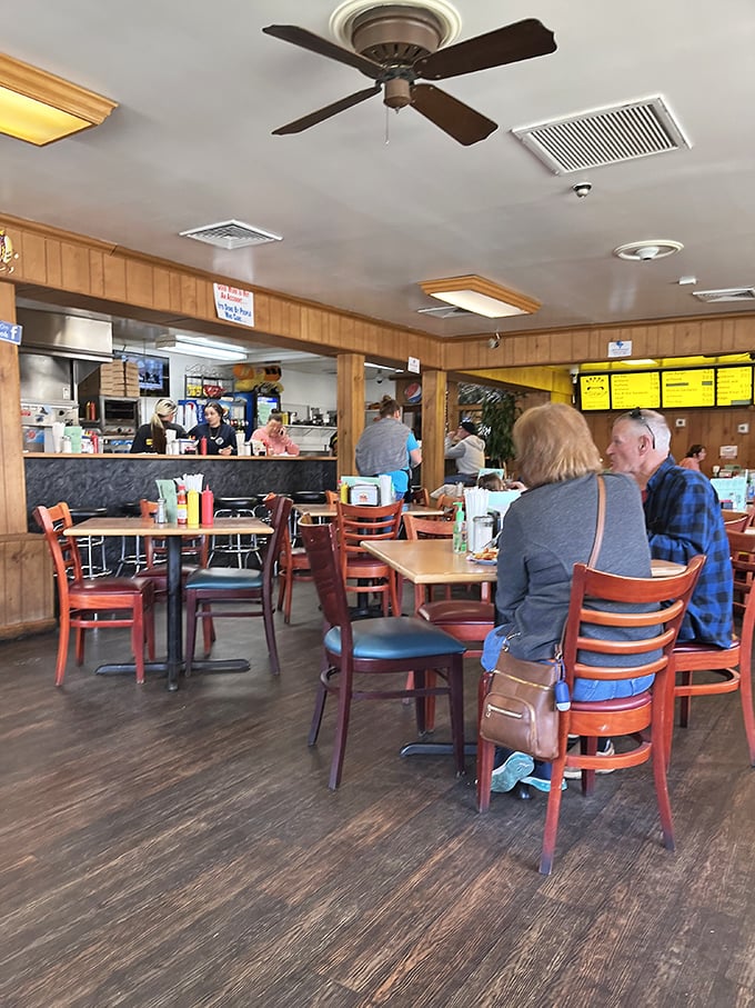 Regulars settle into their favorite spots, proving that the best dining companions are sometimes decades of shared community history and a mutual appreciation for no-nonsense food.