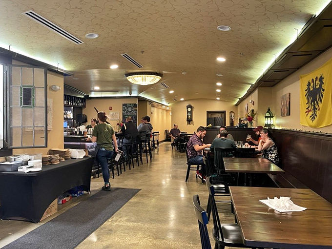 Fellow diners create that perfect restaurant symphony of clinking glasses, satisfied murmurs, and the occasional gasp when the bucket of schnitzel arrives.