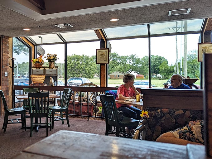 Sunlight streams in as diners enjoy the ritual of good food and conversation. Some people have been sitting in these booths since the Eisenhower administration.