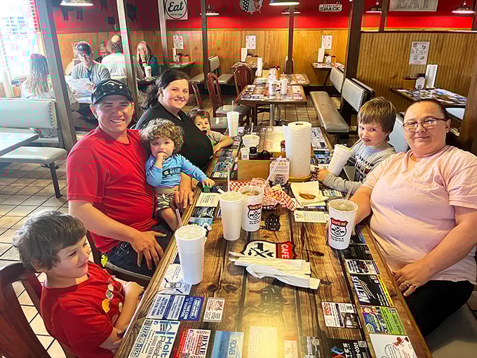 Happiness is a full table at a roadside diner. These folks aren't just eating breakfast; they're creating memories between bites of buttery toast.