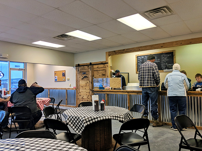 The counter where barbecue dreams come true. That sliding barn door probably hides the smokers where the magic happens.