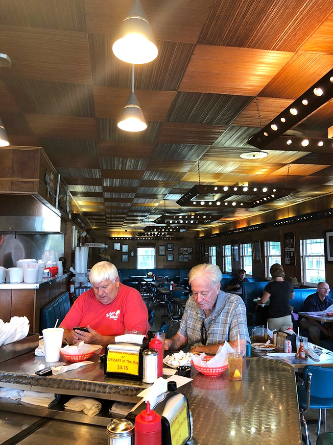 Regulars know the drill: arrive hungry, leave happy, and don't rush the experience. These gentlemen are clearly barbecue veterans enjoying the ritual.