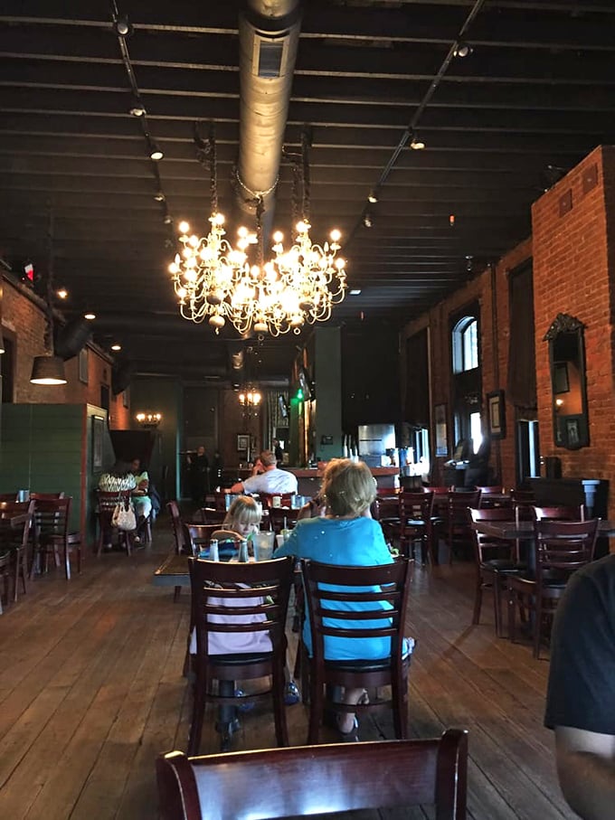 Chandeliers hanging from exposed ceilings create that magical "fancy but not fussy" atmosphere. Where conversations flow as smoothly as the Guinness from the tap.