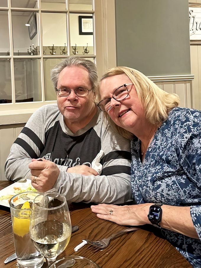 Happy diners sharing moments that matter over glasses of wine&mdash;the true seasoning that makes any meal memorable.