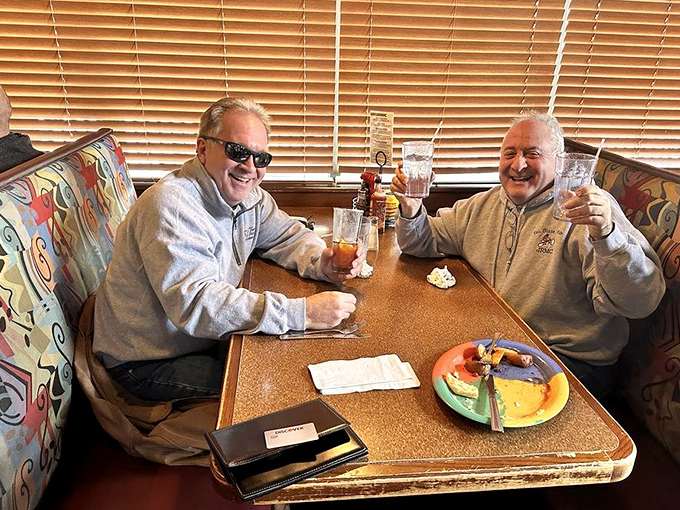 Happy diners toasting to good food and better company &ndash; the universal language of "we've discovered something special here."