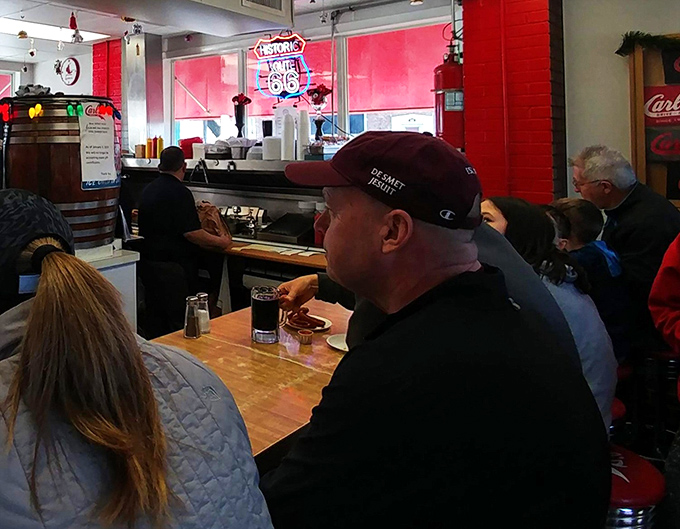 The counter seating creates an instant community of burger enthusiasts&mdash;strangers united by the universal language of "mmm" and "pass the napkins, please."