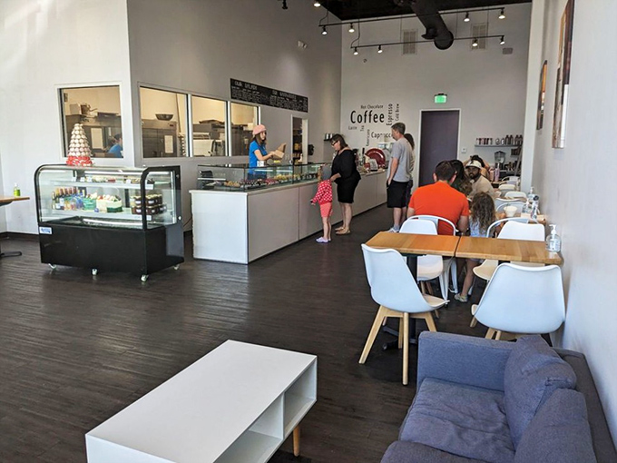 Where pastry pilgrims gather to worship at the altar of butter and flour. The glass case holds the relics of French tradition.