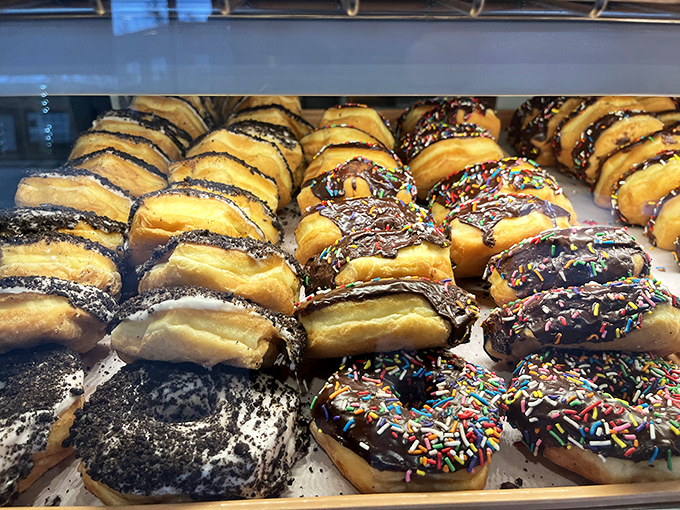 A box of joy containing the full spectrum of donut possibilities&mdash;from classic glazed to chocolate-frosted rebels, each one a different path to happiness.