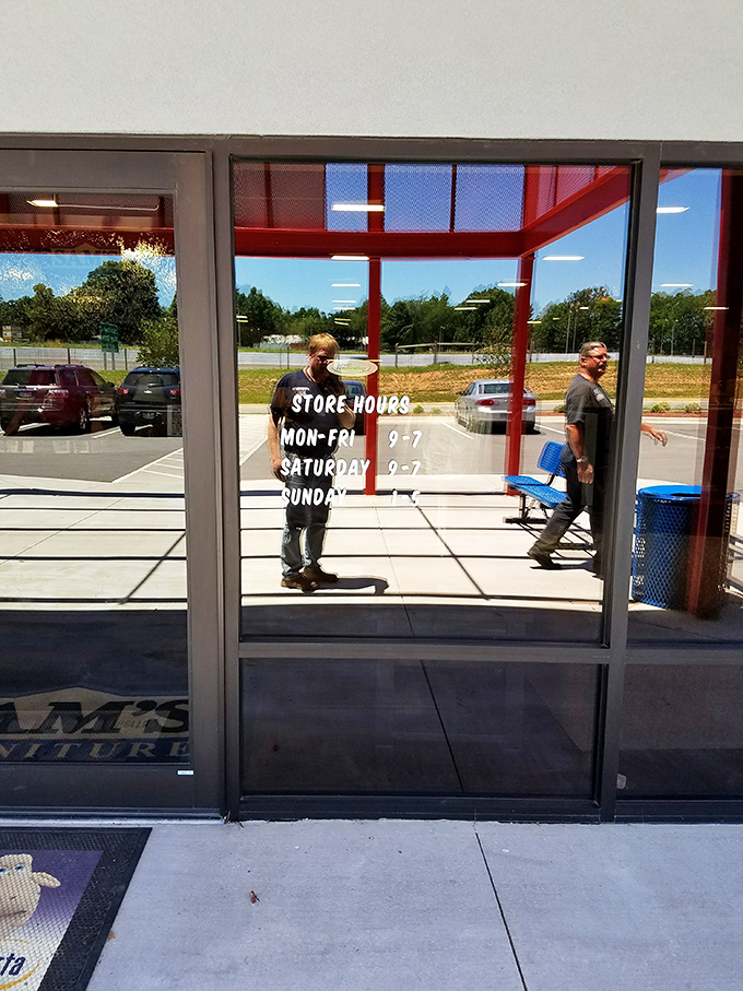 Store hours prominently displayed on the entrance doors&mdash;because furniture dreams don't conform to a 9-to-5 schedule.