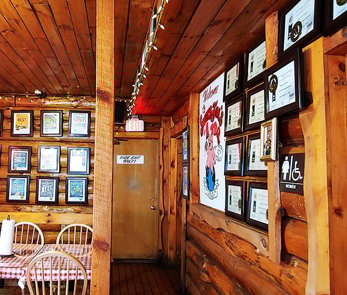 Awards covering every inch of wall space&mdash;not just decoration, but a timeline of smoked meat excellence. Each frame tells a story of barbecue glory.