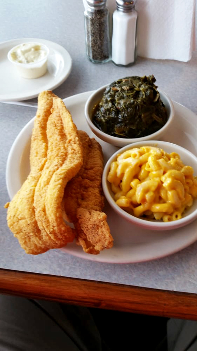 Golden catfish alongside mac and cheese and collard greens&mdash;the holy trinity of soul food satisfaction.