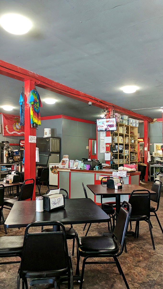 No fancy interior design budget here&mdash;just red support beams, practical tables, and a kitchen focused on what matters: making food that brings people back.