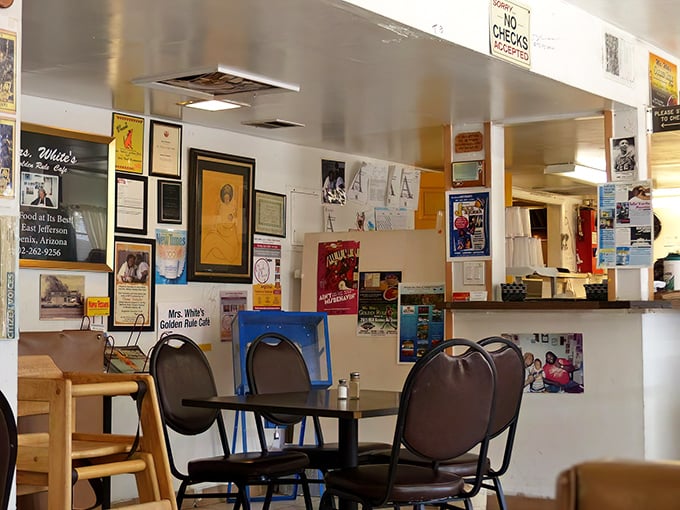 The walls tell the story of decades of satisfied customers, with framed accolades and signatures creating a humble hall of fame for this Phoenix institution.