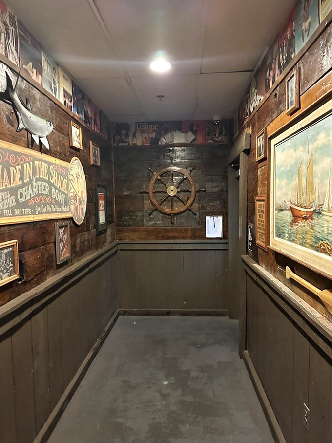 Nautical d&eacute;cor lines the hallway like a portal to coastal living&mdash;ship wheels and weathered signs transporting you far from the desert.