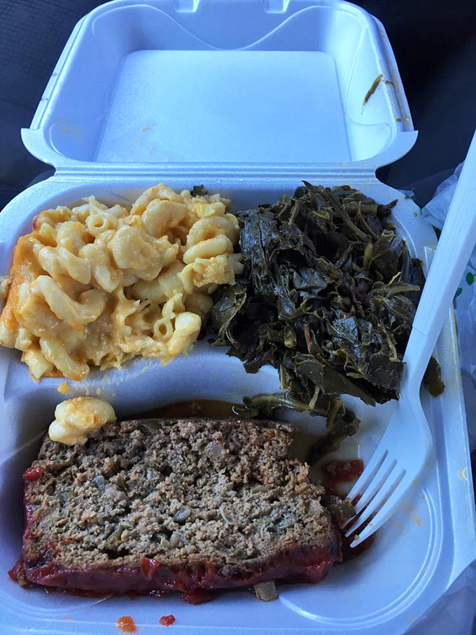 The holy trinity of comfort: meatloaf with tangy glaze, creamy mac and cheese, and collard greens cooked to silky perfection.