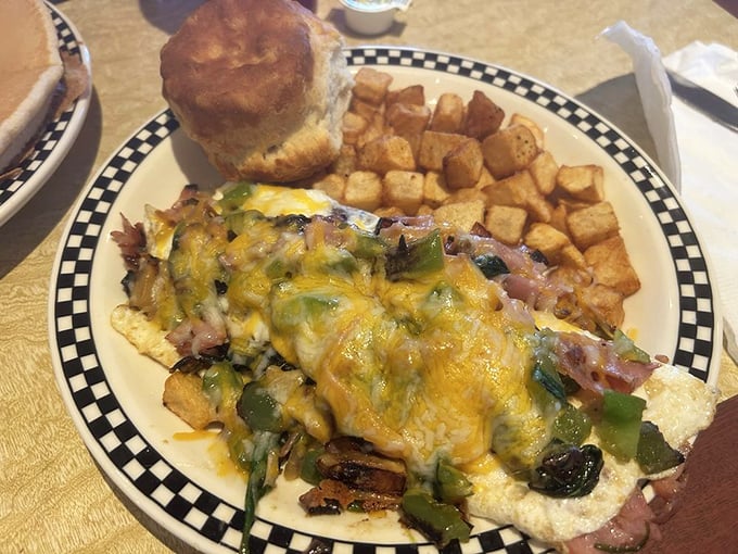 This isn't just breakfast—it's a morning masterpiece where cheese-smothered eggs meet perfectly cubed potatoes in a celebration of AM excellence.