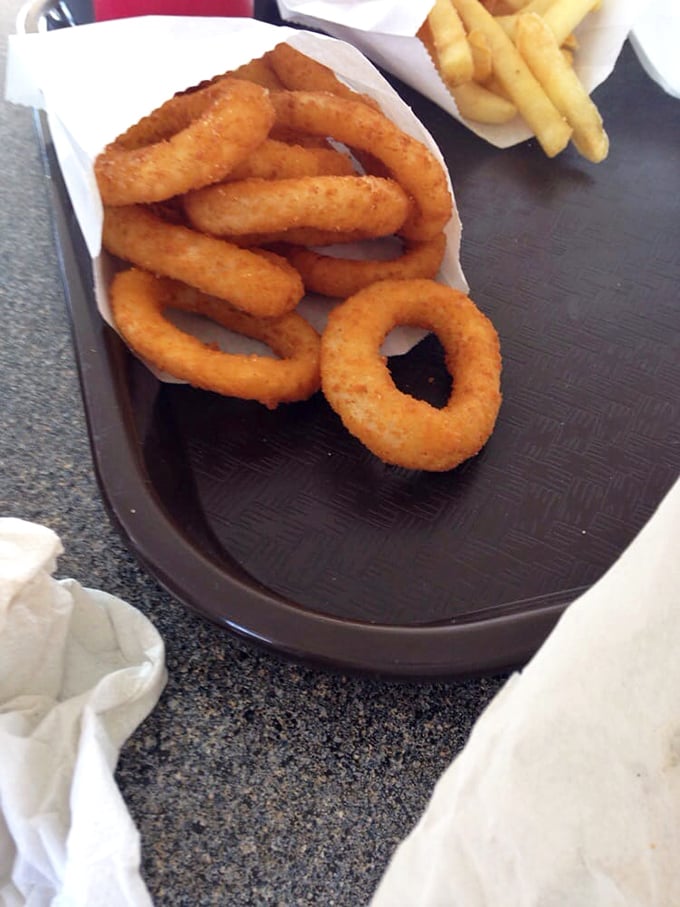 Golden rings of happiness, proving that the humble onion can transcend its tear-inducing reputation to become something worth driving across town for.