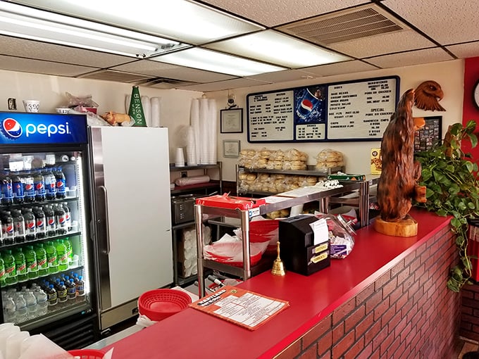 At the ordering counter, dreams come true and diets go to die. Note the wooden eagle&mdash;guardian of good barbecue decisions.