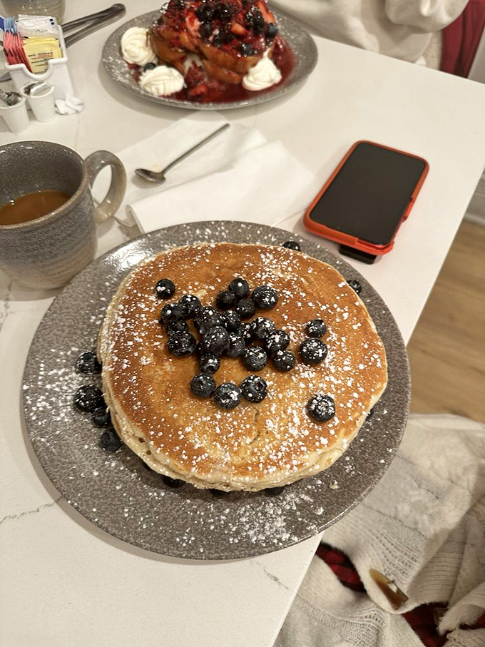 This isn't just a pancake &ndash; it's a canvas where plump blueberries and powdered sugar create edible morning art.