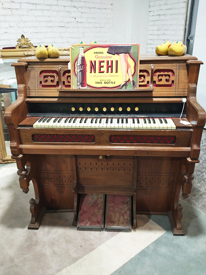This piano isn't just furniture—it's a time machine with keys, topped with decorative pears that have never known hunger.
