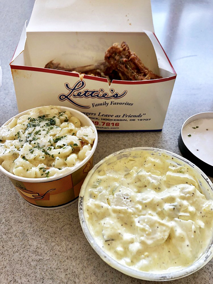 Homemade potato salad and coleslaw flanking Lettie's chicken box &ndash; the supporting actors who deserve their own spinoff show in the comfort food universe.