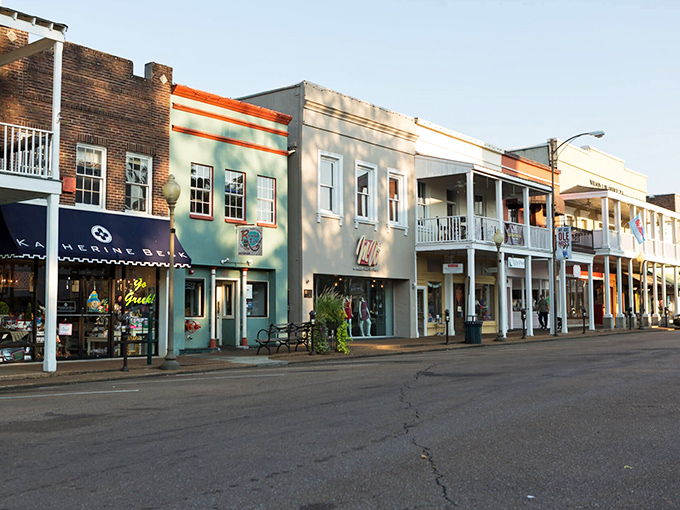 Strolling these colorful storefronts feels like walking through a Southern watercolor painting, each doorway promising unique treasures and local flavors.