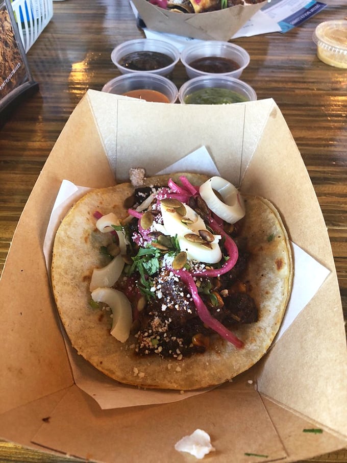 The vegetarian option that makes meat-eaters question their life choices. Mushrooms bringing their A-game with a supporting cast of pickled onions and fresh herbs.