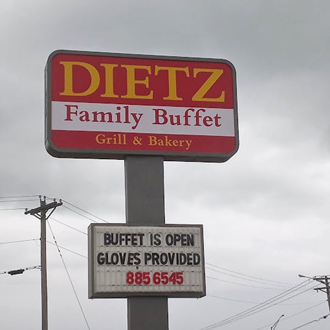 The roadside sign announces "Gloves Provided"&mdash;a pandemic-era reminder that even all-you-can-eat comes with a side of caution.