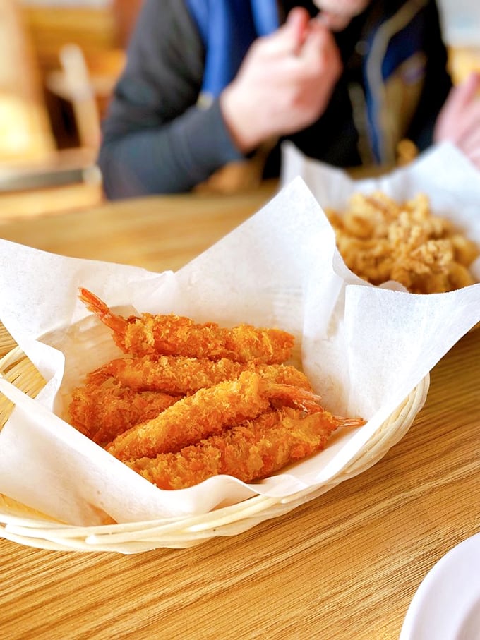 Tempura shrimp lined up like delicious soldiers ready to march straight into your heart. Crispy outside, tender within &ndash; nature's perfect design.