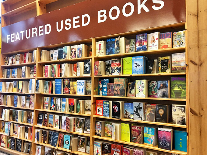 The rare book room glows with amber light, like a library from a Wes Anderson film. Literary treasures await those who appreciate aged wisdom.