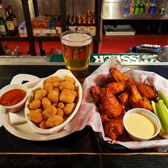 Wings and nuggets: the dynamic duo of bar food. One spicy, one cheesy, both fighting the good fight against hunger.