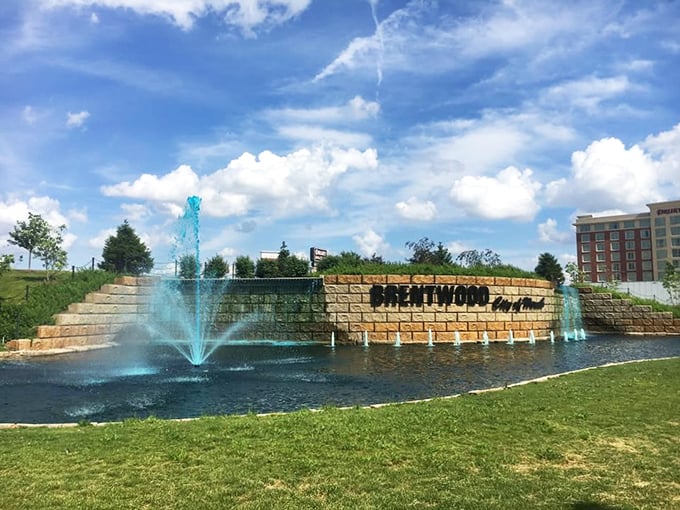 Brentwood's welcoming entrance fountain sets the tone for this upscale community. Blue water dances cheerfully against the backdrop of the town's name in bold letters.