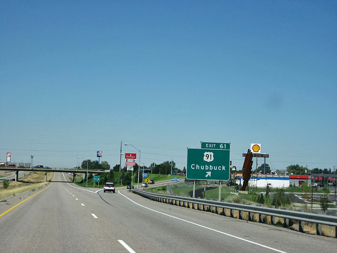 The highway sign welcoming travelers to Chubbuck, one of Idaho's hidden gem towns worth exploring.