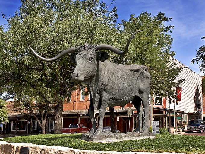 Dodge City's famous longhorn statue stands guard over downtown &ndash; a bronze reminder of the town's wild cattle drive days.