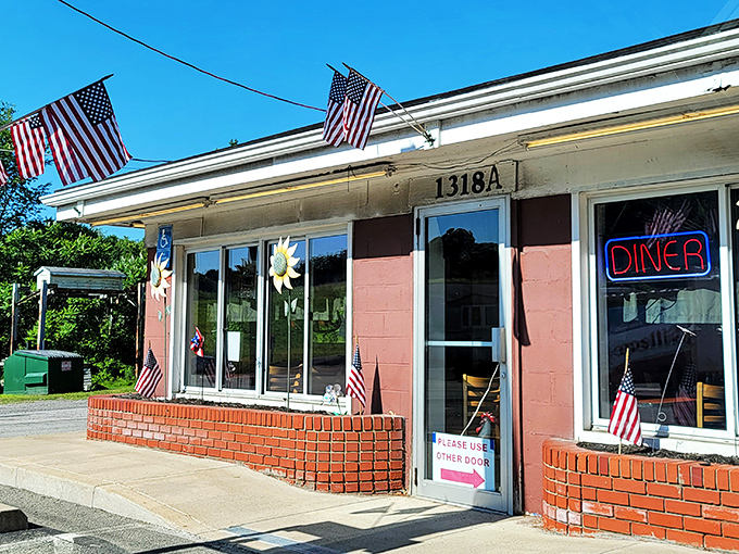 Jimis' Sunnyside Up Diner (daytime): Pink exterior, American flags, and a promise of breakfast that'll make you forget all about your fancy brunch reservations.