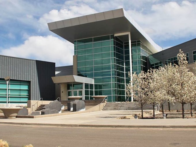Welcome to Commerce City, Colorado! This modern local building shines under bright blue skies, reflecting our community&rsquo;s vibrant, growing spirit.