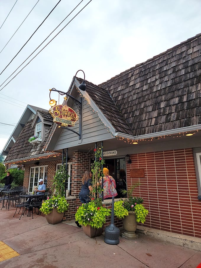 Those hanging plants and outdoor seating whisper promises of summer evenings spent lingering over incredible meals. Supper club perfection in brick form.